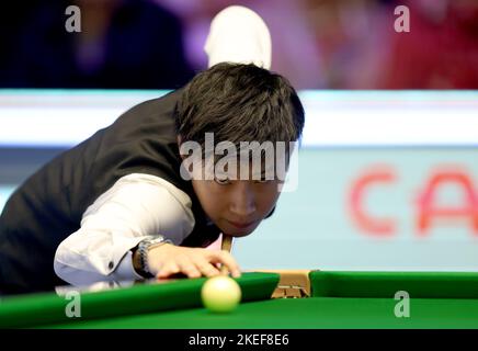 Zhao Xintong in action against Gary Wilson (not in picture)on day two ...