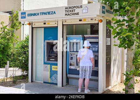 Athens, Greece - May 2022: Person using a long handled hedge cutter to ...