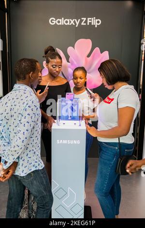 The customers viewing Samsung phones at mall pop-up retail stand Stock ...