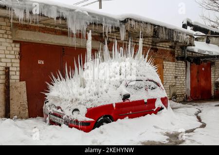The car under snow is stuck with large icicles, winter: Russia ...
