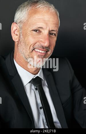 What it means to be white collar. a handsome mature businessman in ...