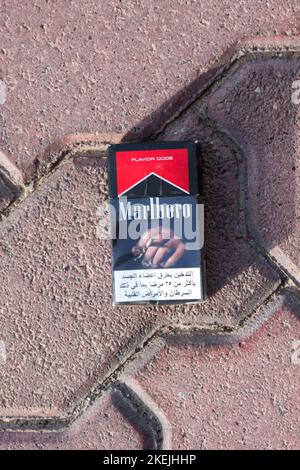 A discarded cigarette pack packet cigarettes depicting a child ...