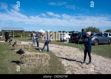 Young girls practicing throwing rope in a local park. Houston, Texas ...