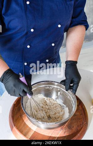 Woman sifting flour through old sieve on kitchen board Stock Photo - Alamy