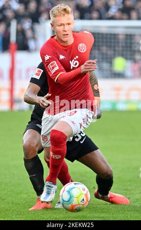 Mainz's Jonathan Burkhardt plays against Kiel's Nicolai Remberg during ...