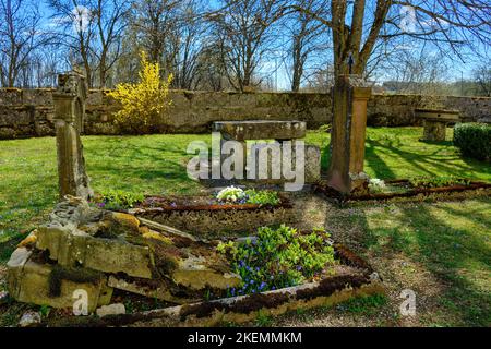 Churchyard of the deserted village of Gruorn, former military training ...