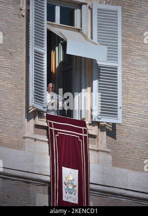 Pope Francis waves during the Angelus noon prayer from the window of ...