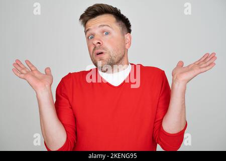 man clueless and confused expression with arms and hands raised Stock ...
