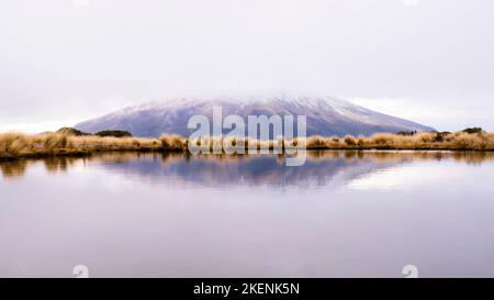 Water reflection in Pouakai Tarn Mountain Lake at sunset, Stratovolcano ...