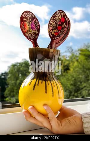 Colorful spoons made from wood in a vase Stock Photo - Alamy