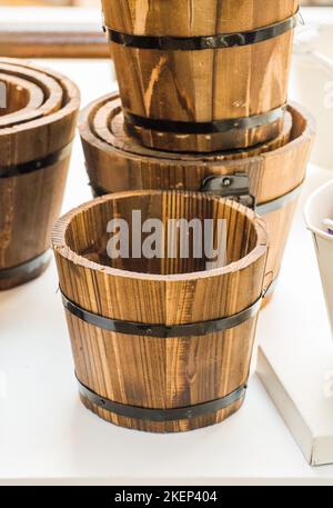 Set of buckets made of wood in a market place Stock Photo - Alamy