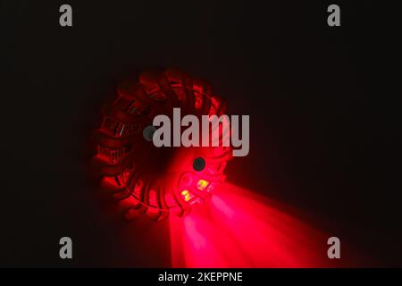 Accidents and danger. A burning red lamp on the wall indicates danger ...