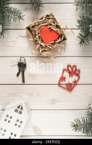 House model with key and Christmas decor on green background Stock ...