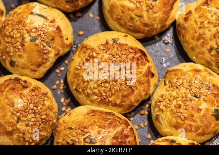 Sesame bun. Pogaca in a tray. close up Stock Photo - Alamy