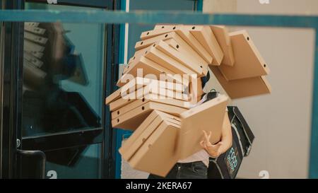 Reckless delivery worker dropping pizza boxes, scared courier running ...