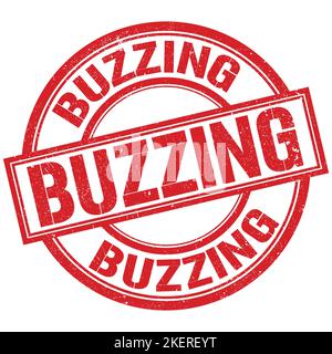 BUZZING text written on red round stamp sign Stock Photo - Alamy