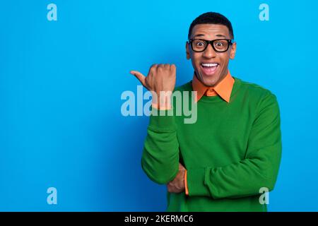 Photo impressed ecstatic crazy man wear orange shirt under green ...