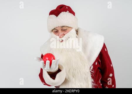 New year and villain concept. Santa Claus is holding a virus in his ...