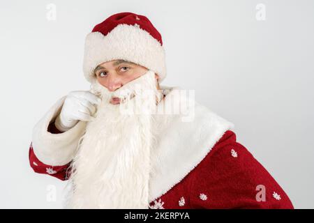 New year and villain concept. Santa Claus is holding a virus in his ...