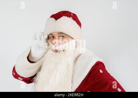 New year and villain concept. Santa Claus is holding a virus in his ...