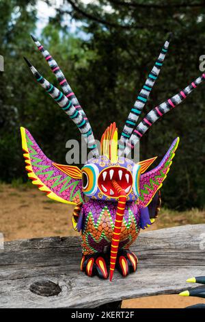Brightly painted alebrijes carved of copal wood representing real and ...