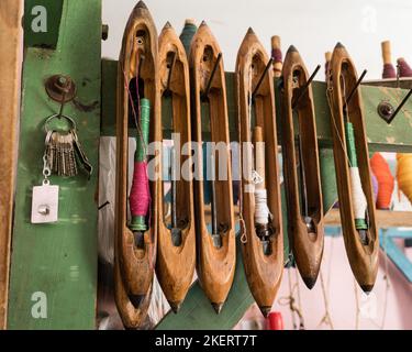 Textile industry flying shuttles in a woven basket on display at ...