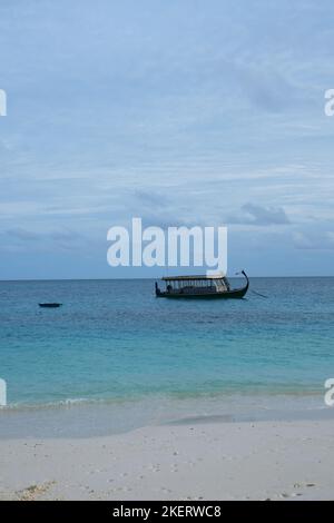 A Dhoni is a traditional multi-purpose sailvessel with a motor or ...