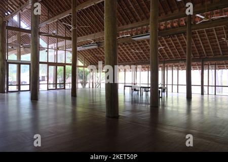 A wooden made hall with a spacious social area and corridor at Janda ...