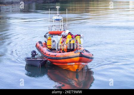RNLI RIB and Crew Rescuing small boat Stock Photo - Alamy