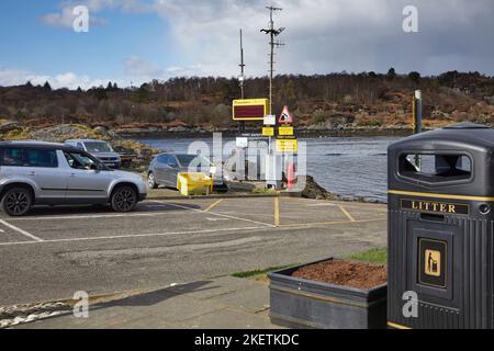 Cars waiting at the ferry port of Tarbert to Portavadie. The Erin Julia ...