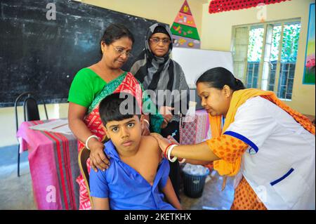 Non Exclusive: Nov 13 2022 Sylhet, Bangladesh: A child receives the ...
