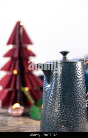 Beautiful textural teapot on a blurred background in a cozy home ...