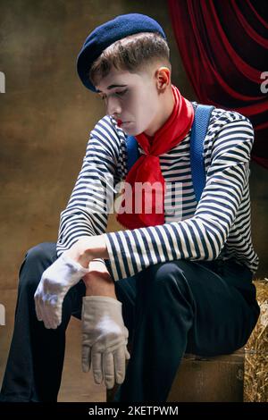Dramatic closeup portrait of sad mime artist performing on stage with ...