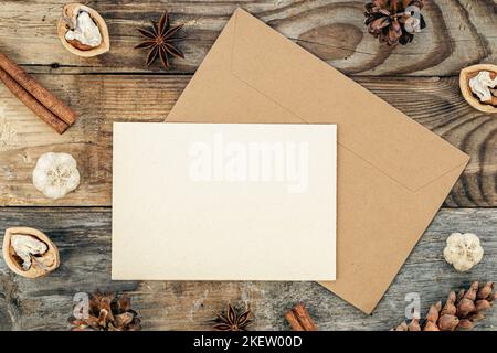 Blank paper, concert, cones and spices on a wooden background, flat lay ...