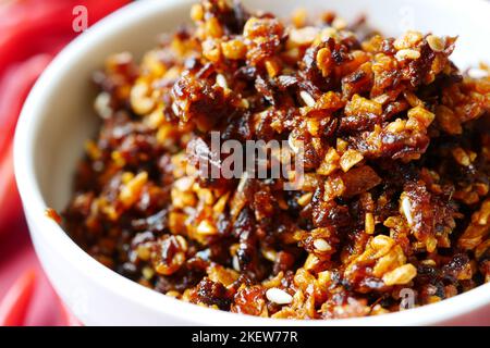 chili and garlic flakes in a container Stock Photo - Alamy