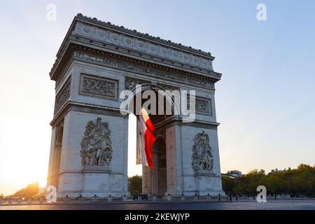 The Triumphal Arch decorated with French flag, Paris, France Stock ...