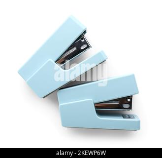Two staplers on white background Stock Photo - Alamy