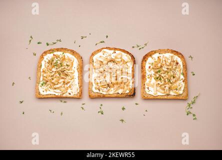 Tasty toasts with cream cheese, mushrooms and spices on light ...