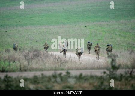 army soldiers on a military tabbing exercise with 40Kg bergen and anti ...