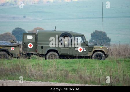 A British Army Battlefield Ambulance Land Rover travelling along the ...