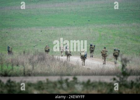 army soldiers on a military tabbing exercise with 40Kg bergen and anti ...