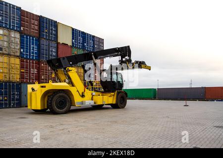 Container handlers. Forklift truck in shipping yard. Industrial ...