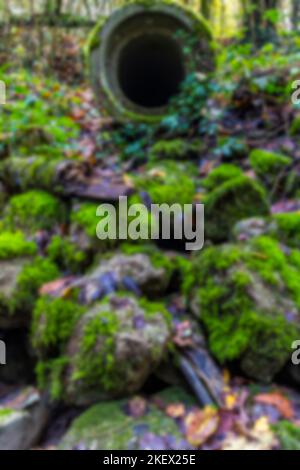 sewer. waste water flow to sewer with moss, bad water from city, water ...
