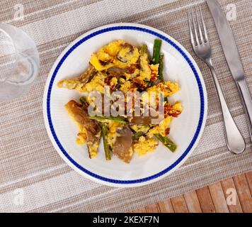 Popular breakfast of Spanish cuisine is Revuelto Stock Photo - Alamy