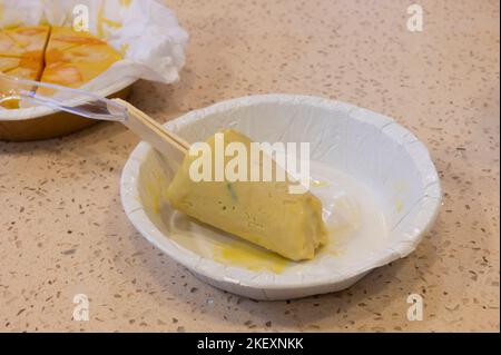 Mango kulfi and keshar kulfi , served on plates. Popular Indian sweet ...