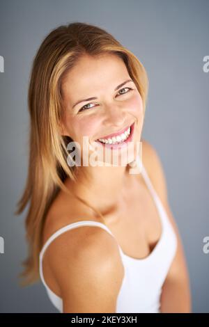 Young female is posing positively against white background Stock Photo ...