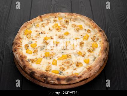 Sweet Gorgonzola pizza with honey and peach on wooden background Stock ...