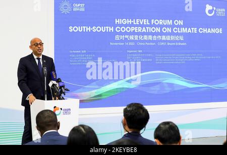 Simon Stiell, United Nations climate chief, holds up a pamphlet that ...