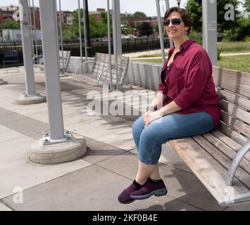 Beautiful middle age woman over isolated background Pointing with ...