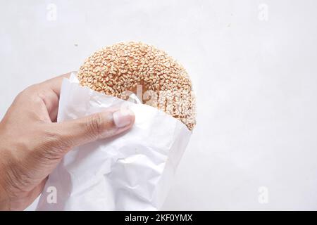 fresh bagel bread in a paper on table Stock Photo - Alamy
